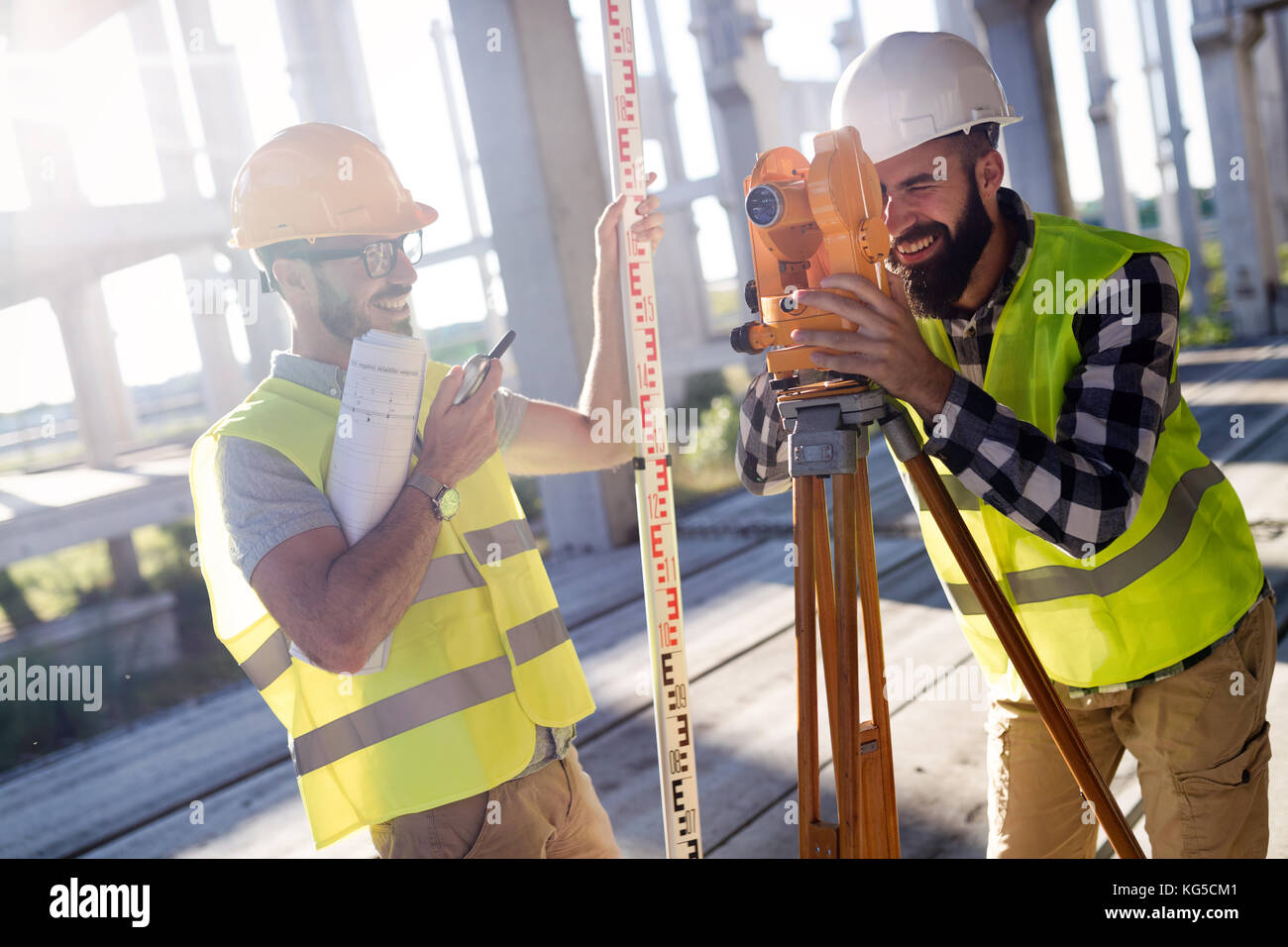 Portrait of construction engineers working on building site Stock Photo ...