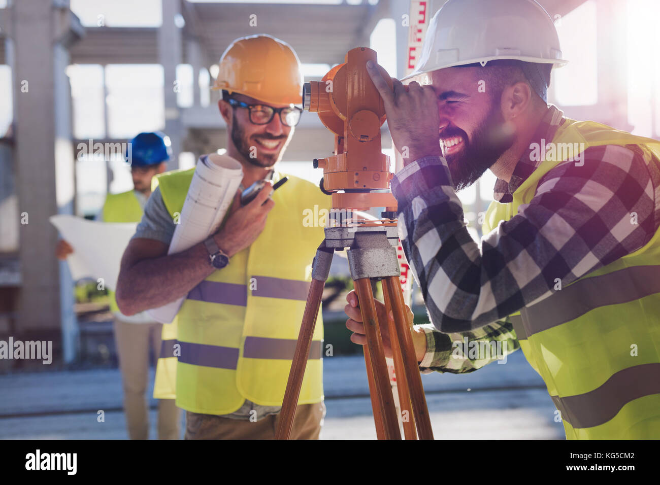 Portrait of construction engineers working on building site Stock Photo ...