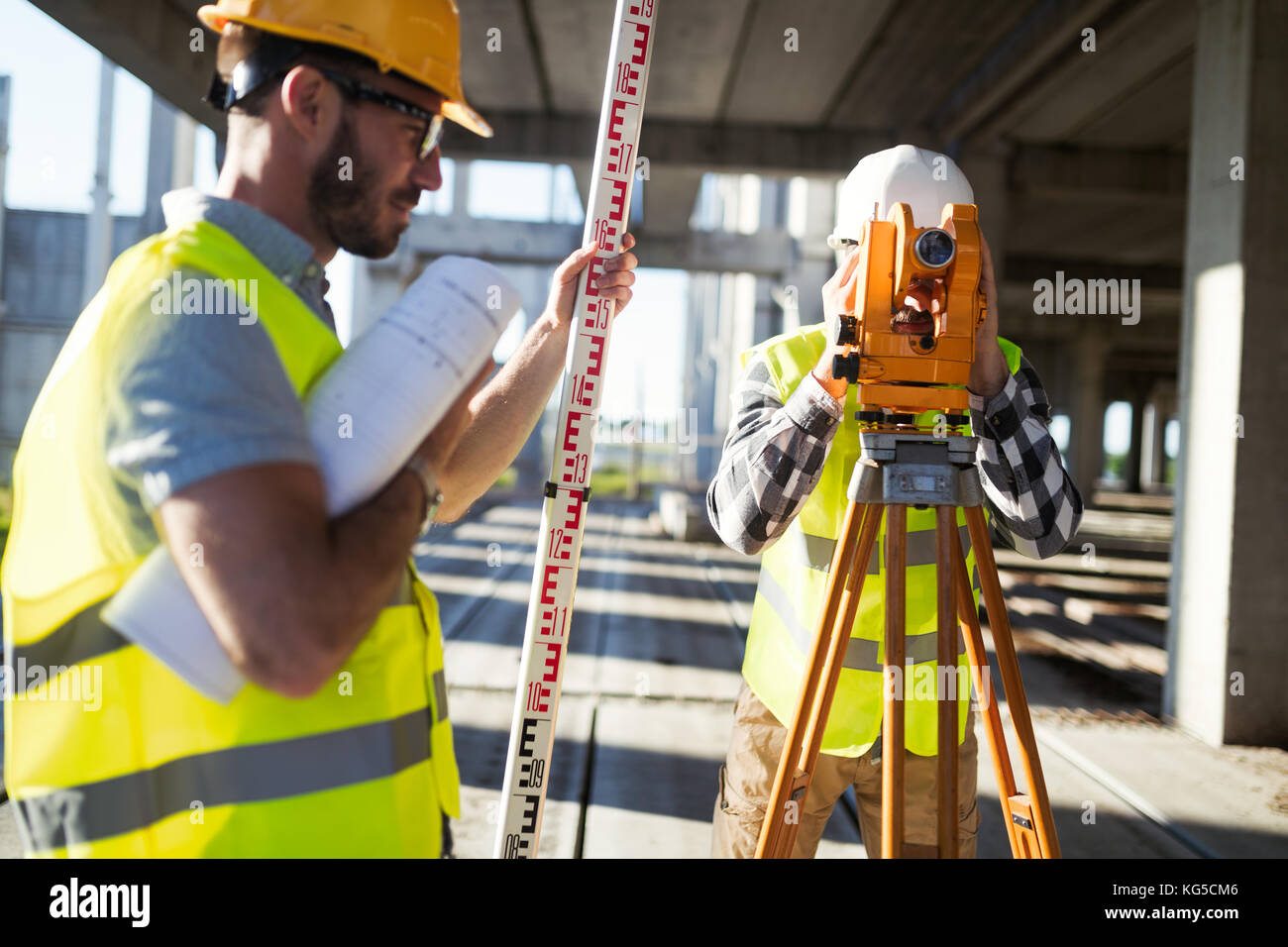 Portrait of construction engineers working on building site Stock Photo ...
