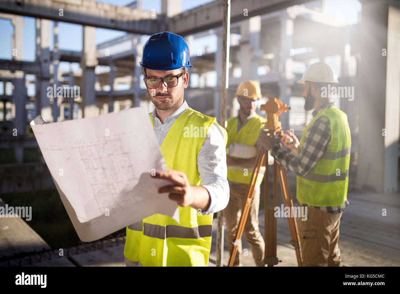 Portrait of construction engineers working on building site Stock Photo ...