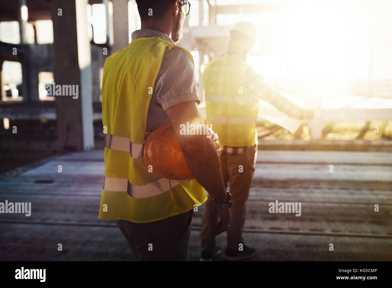 Portrait of construction engineers working on building site Stock Photo ...