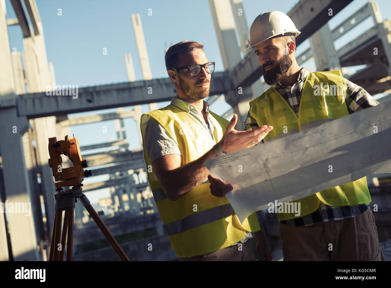 Portrait of construction engineers working on building site Stock Photo ...