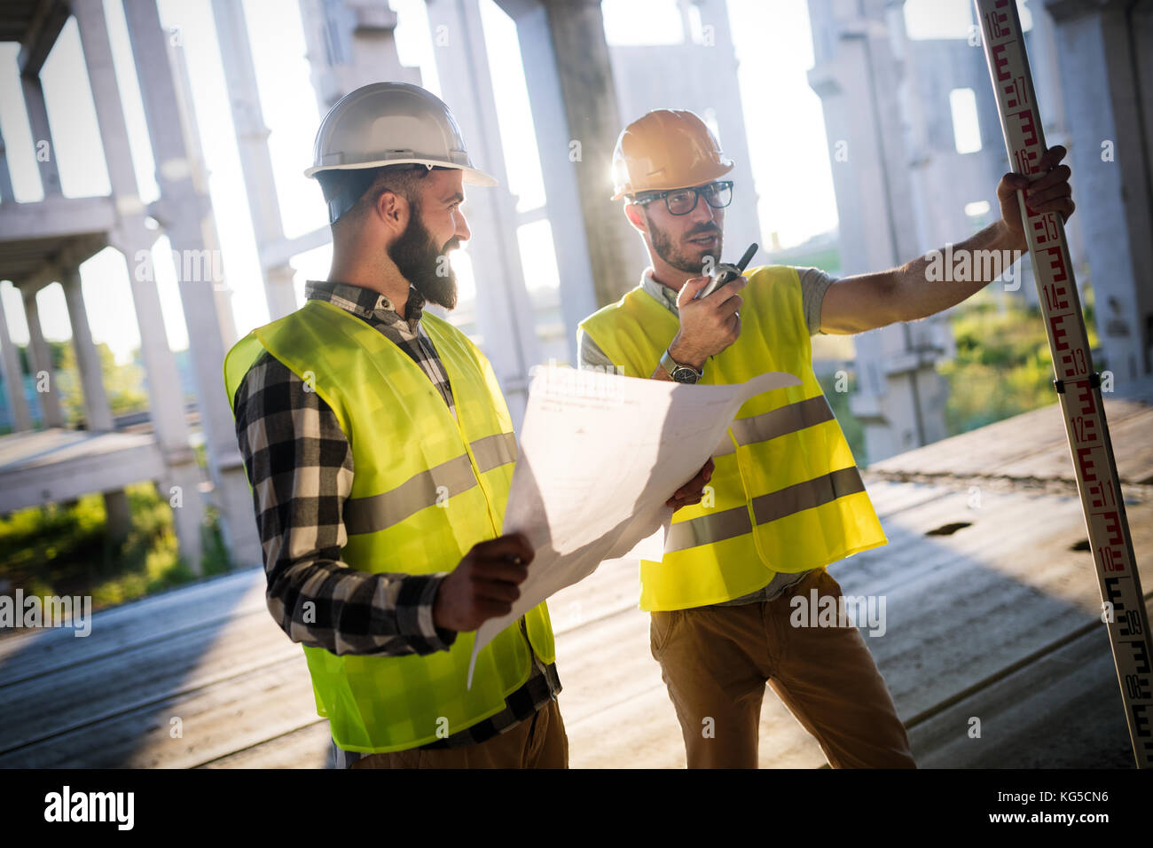 Portrait of construction engineers working on building site Stock Photo ...