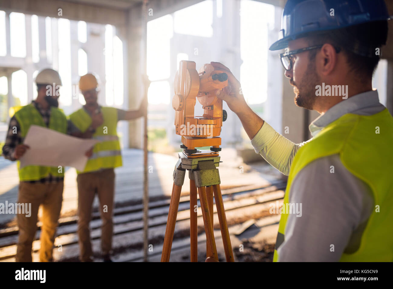 Portrait of construction engineers working on building site Stock Photo ...
