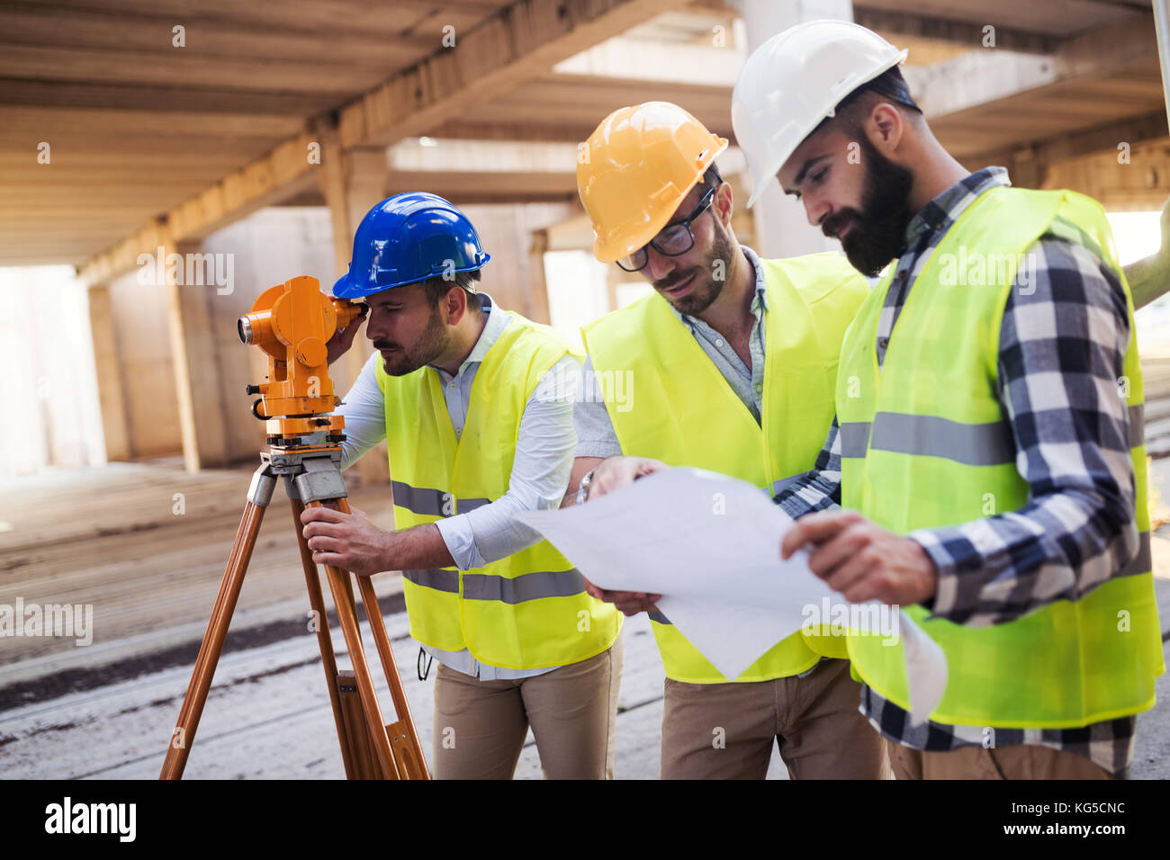 Portrait of construction engineers working on building site Stock Photo ...