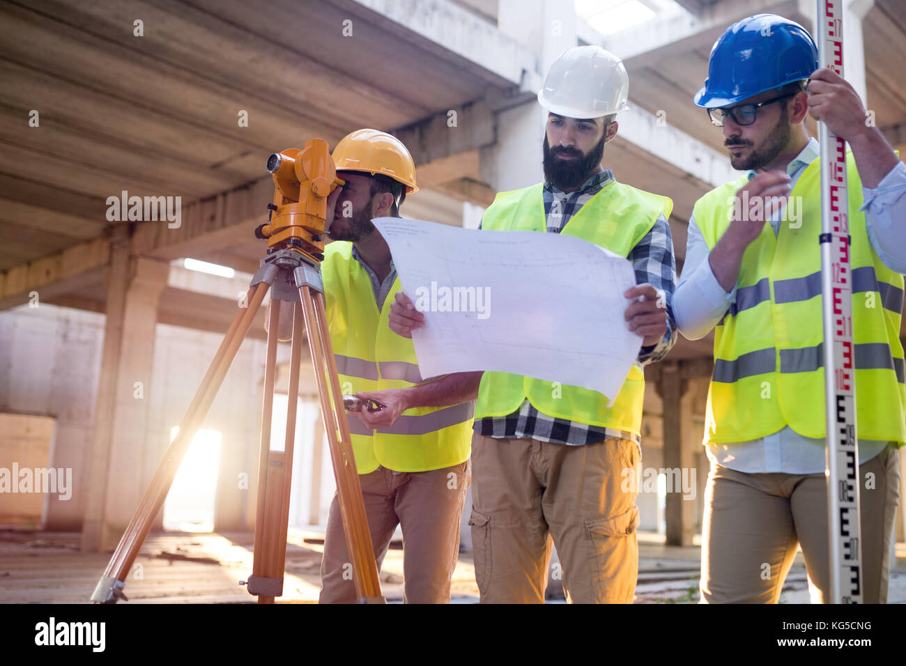 Portrait of construction engineers working on building site Stock Photo ...