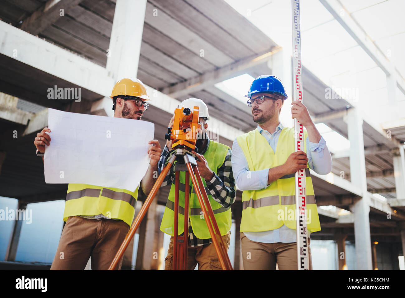 Portrait of construction engineers working on building site Stock Photo ...