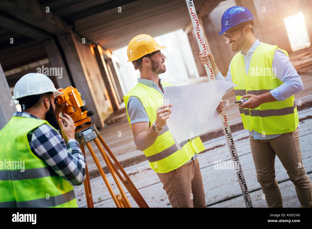 Portrait of construction engineers working on building site Stock Photo ...