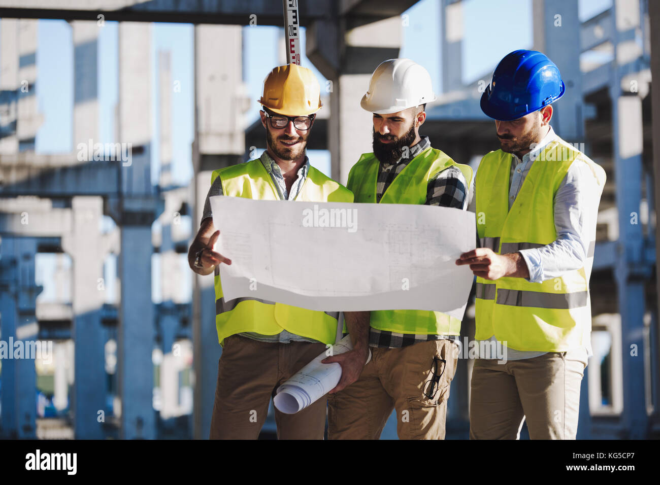 Portrait of construction engineers working on building site Stock Photo ...