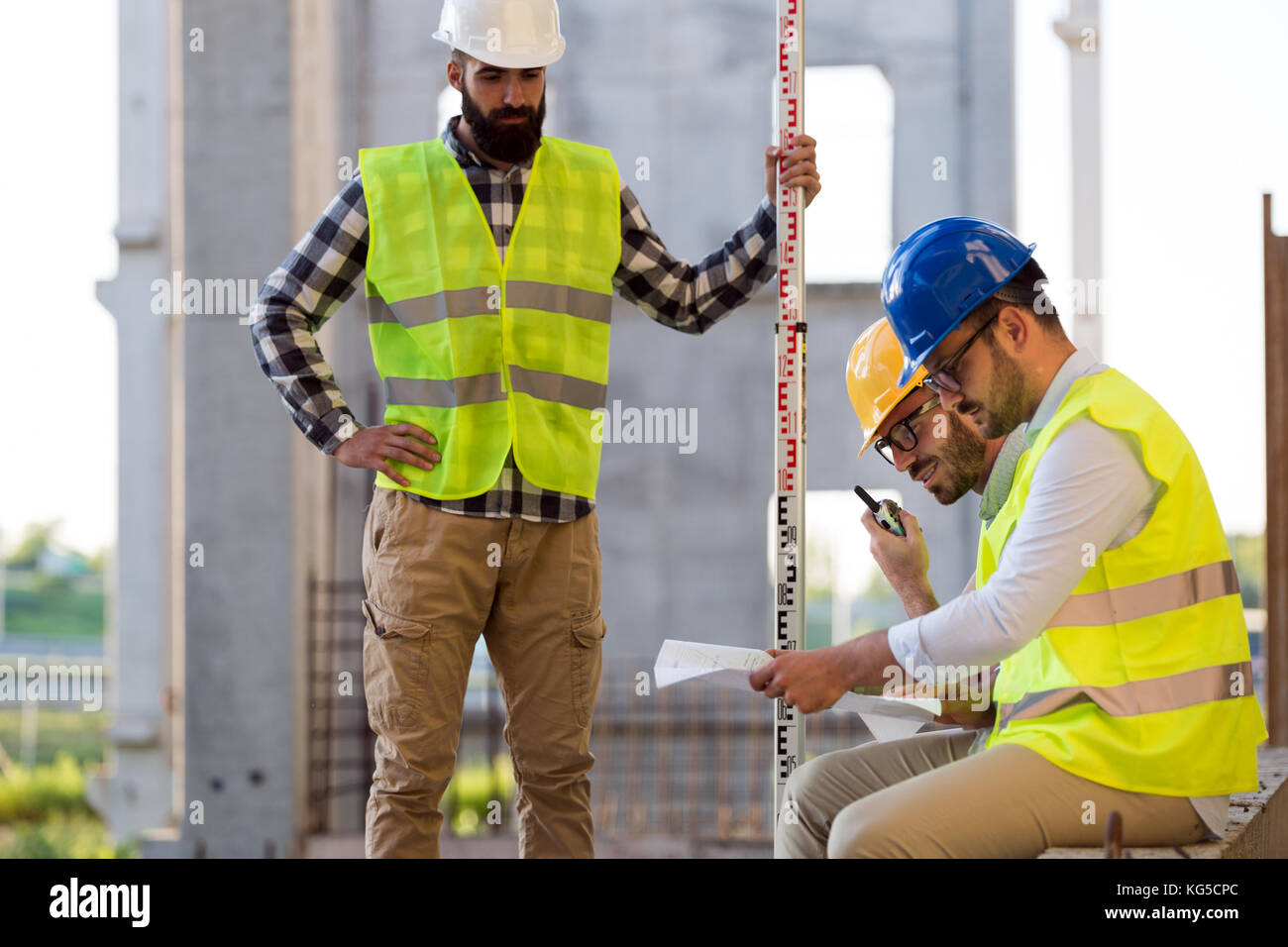 Portrait of construction engineers working on building site Stock Photo ...