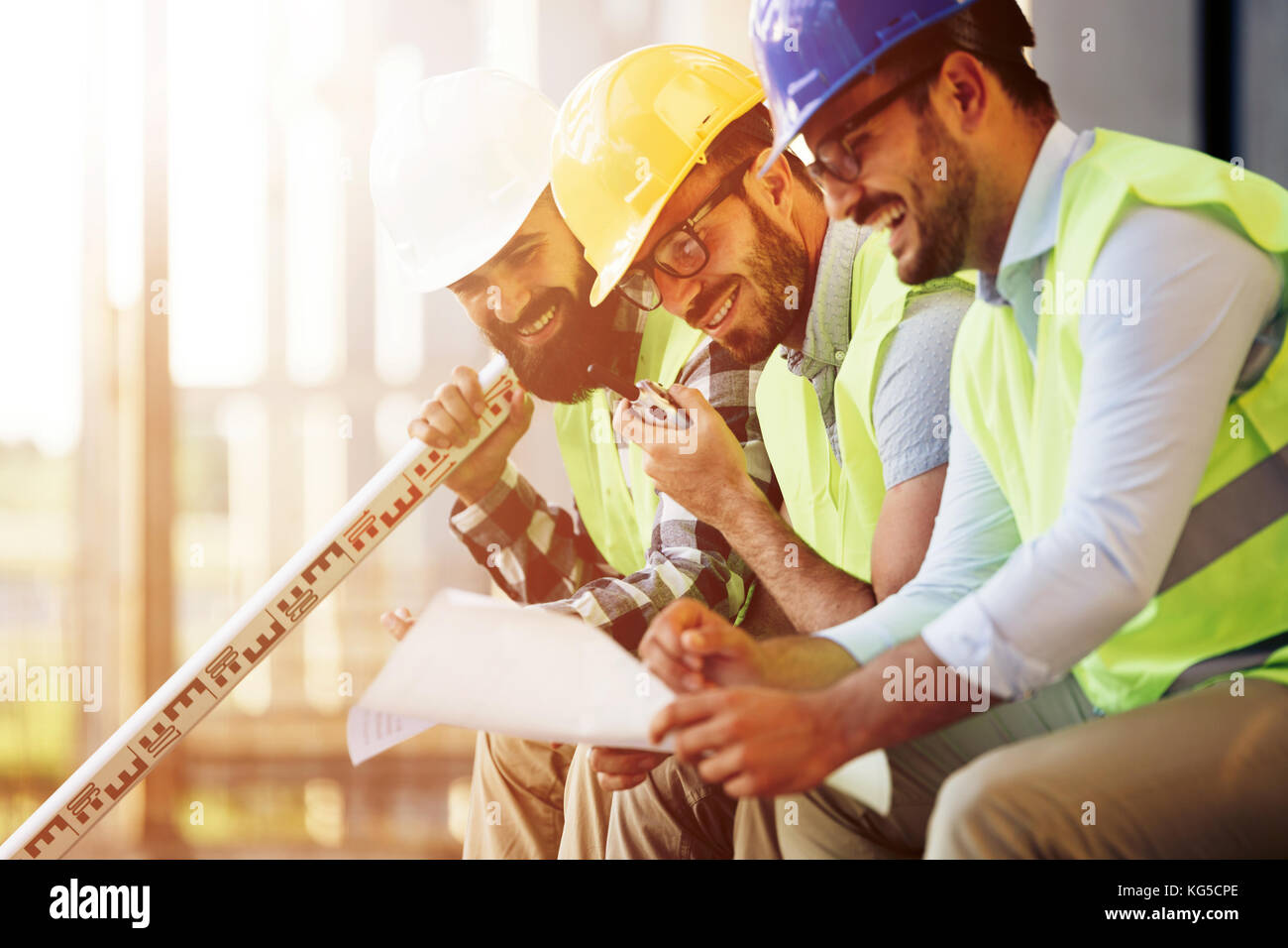 Portrait of construction engineers working on building site Stock Photo ...