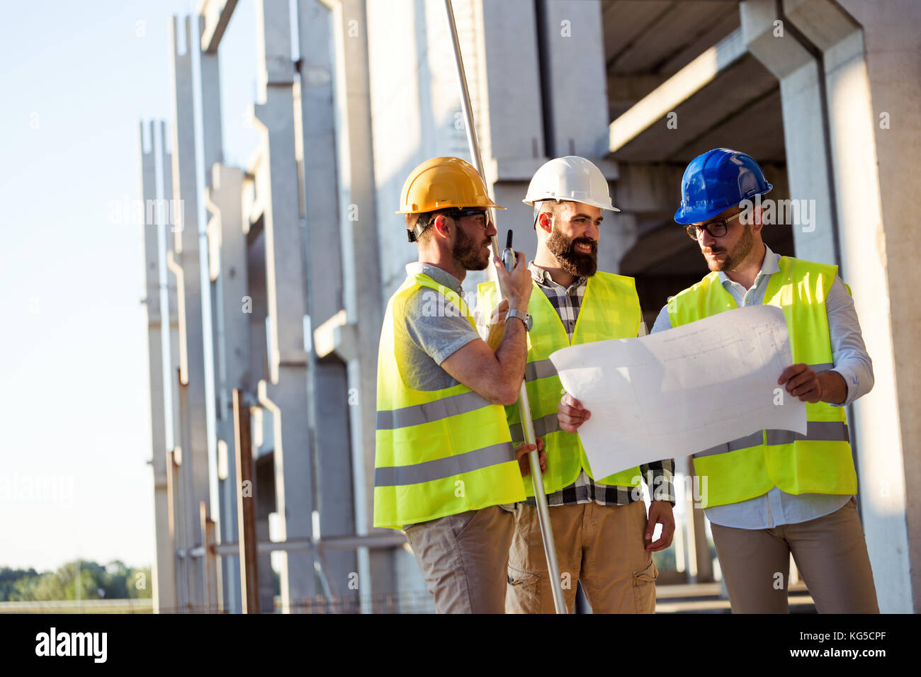 Portrait of construction engineers working on building site Stock Photo ...