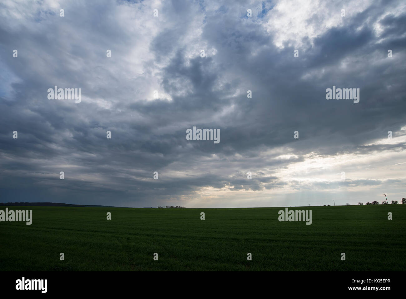 Dark dramatic landscape stormy sky over field Stock Photo - Alamy