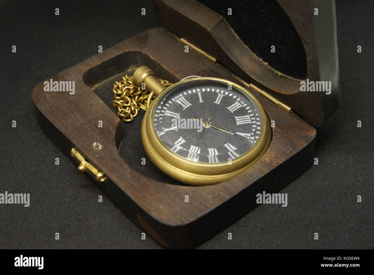 Antique old wrist watch in wood box.Isolated on black background Stock ...