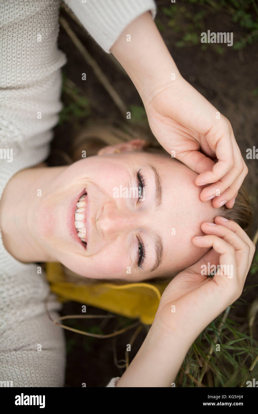 young woman smiling in nature Stock Photo - Alamy