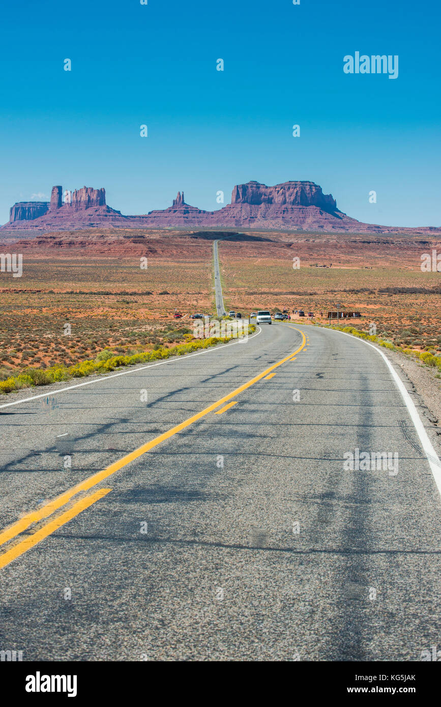Long road leading into the Monument valley, Arizona, USA Stock Photo ...