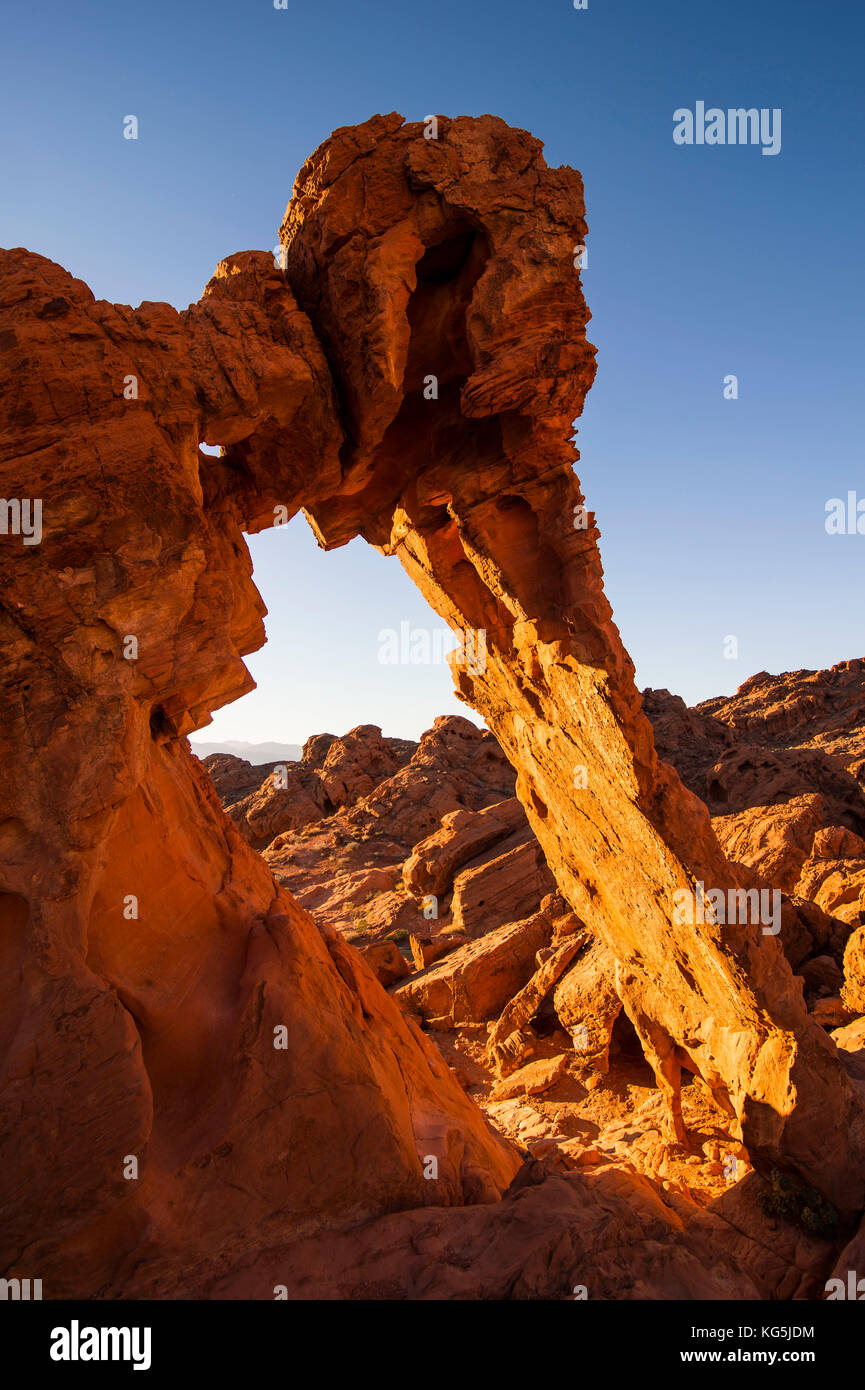 Redrock sandstone arch at sunrise in the Valley of fire state park ...