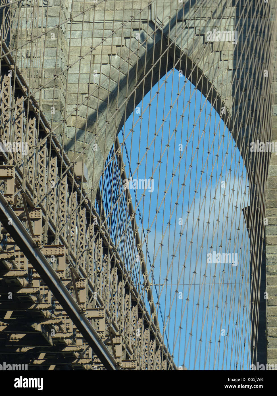 Brooklyn Bridge, built in 1883, with arch and the mesh of steel cables ...