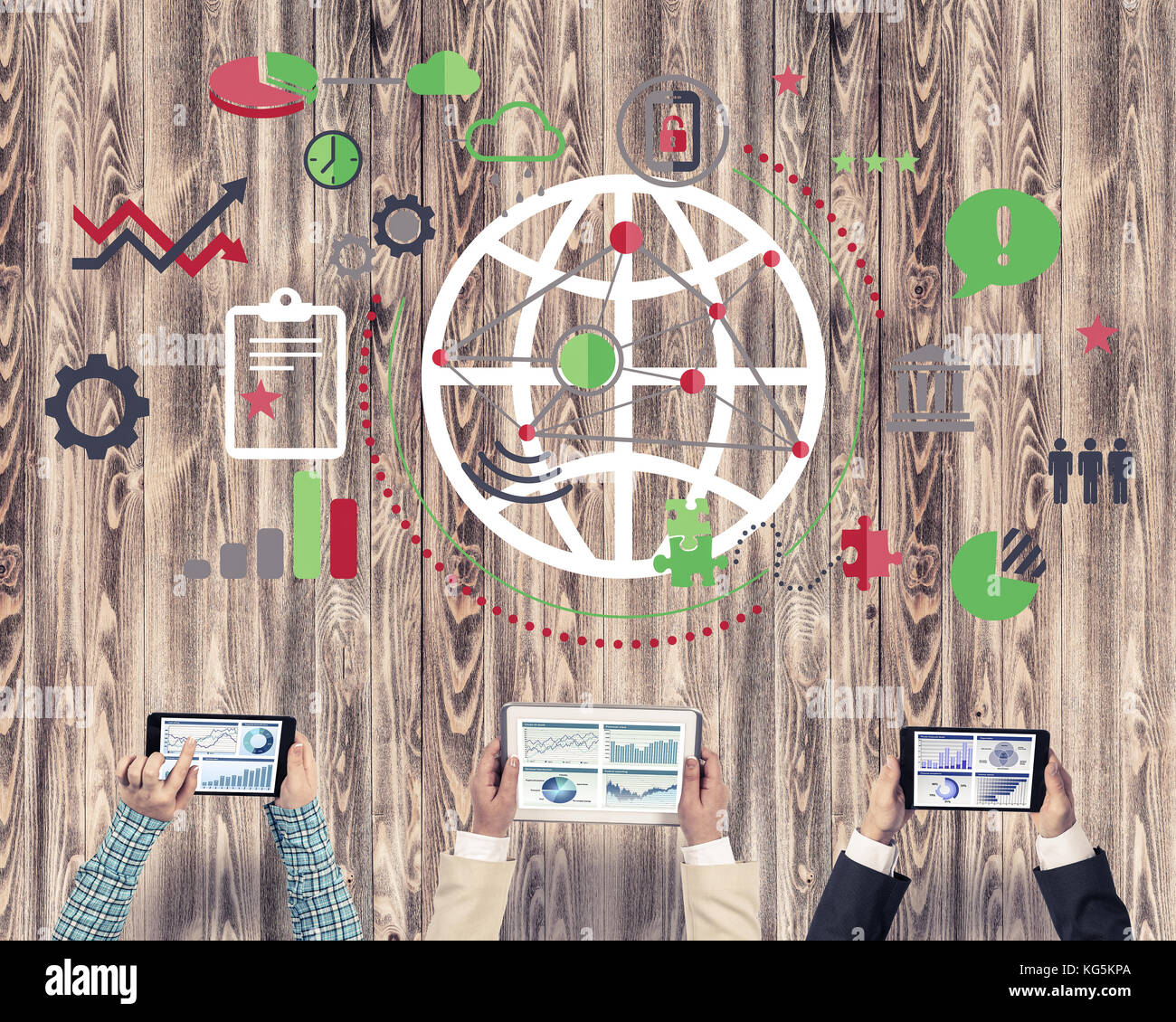 Group of three people with devices in hands working together as symbol ...