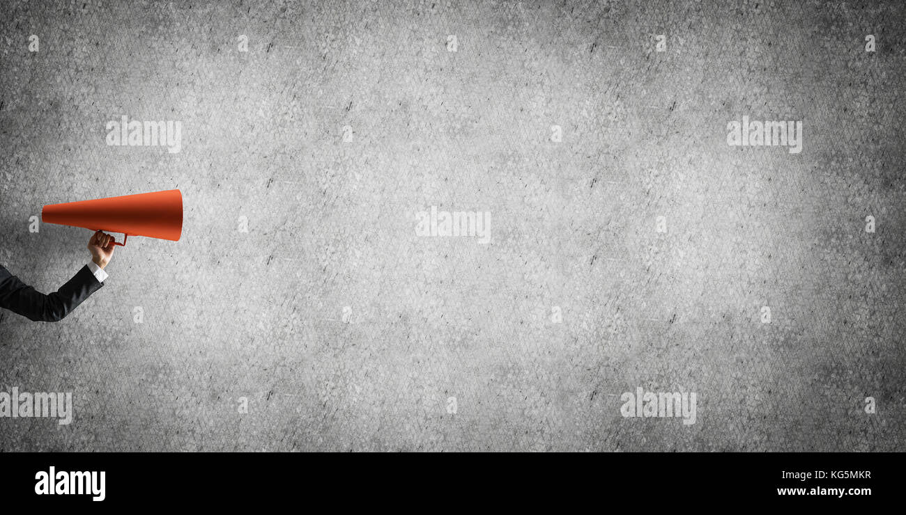 Close of businesswoman making announcement in paper trumpet Stock Photo ...