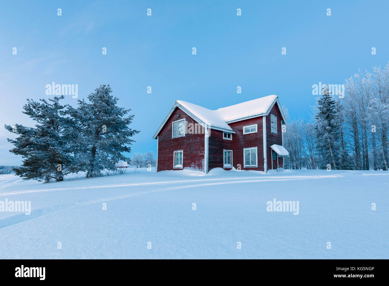Dusk on wood house in the boreal forest (Taiga) covered with snow ...