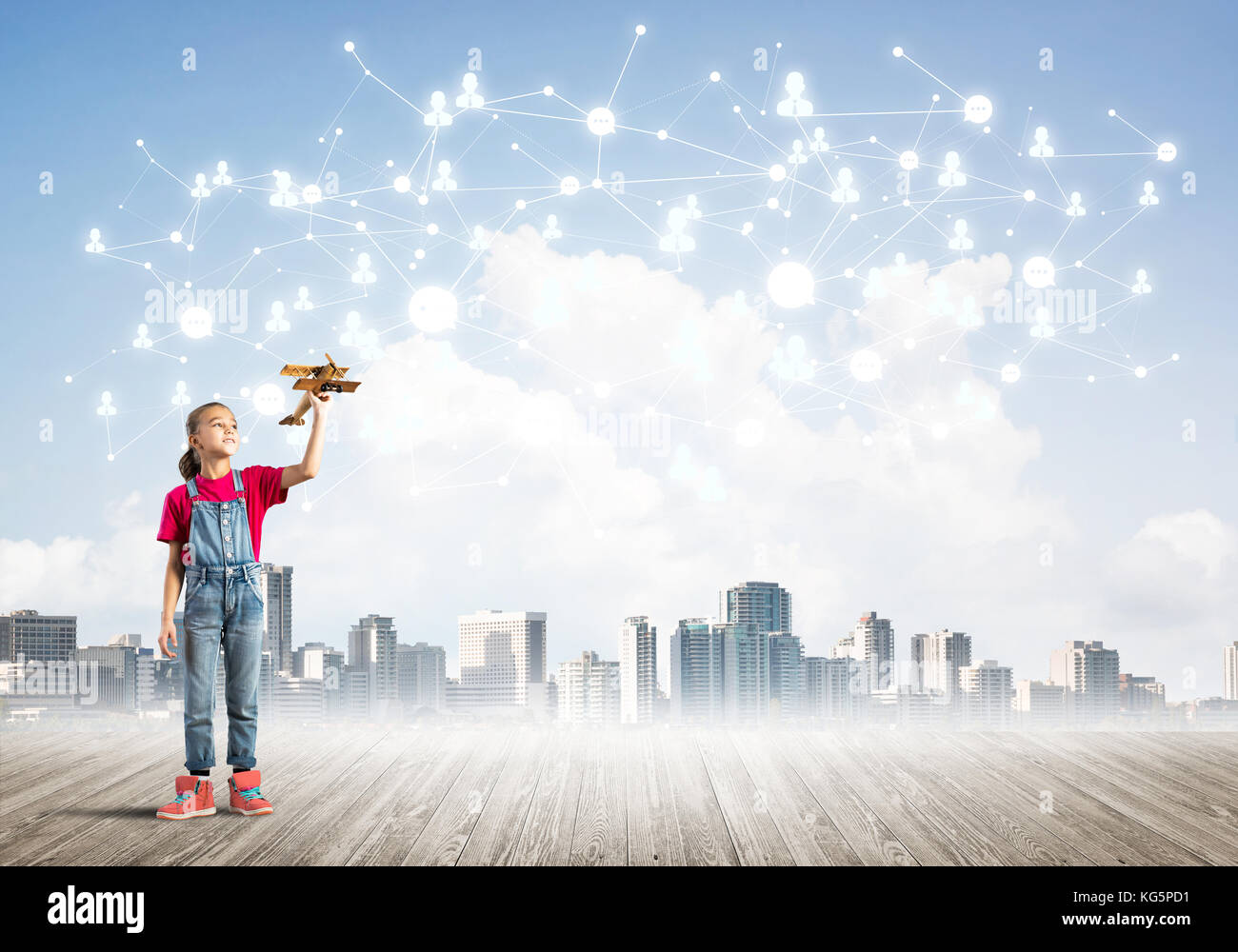 Cute kid girl standing on wooden floor and play with plane Stock Photo ...