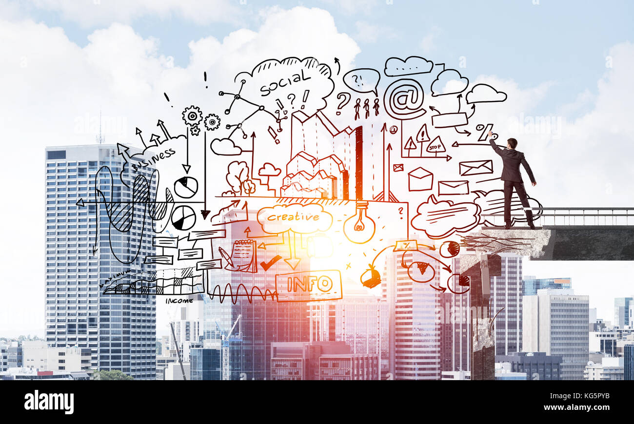 Businessman in suit drawing business-analytical strategy while standing ...