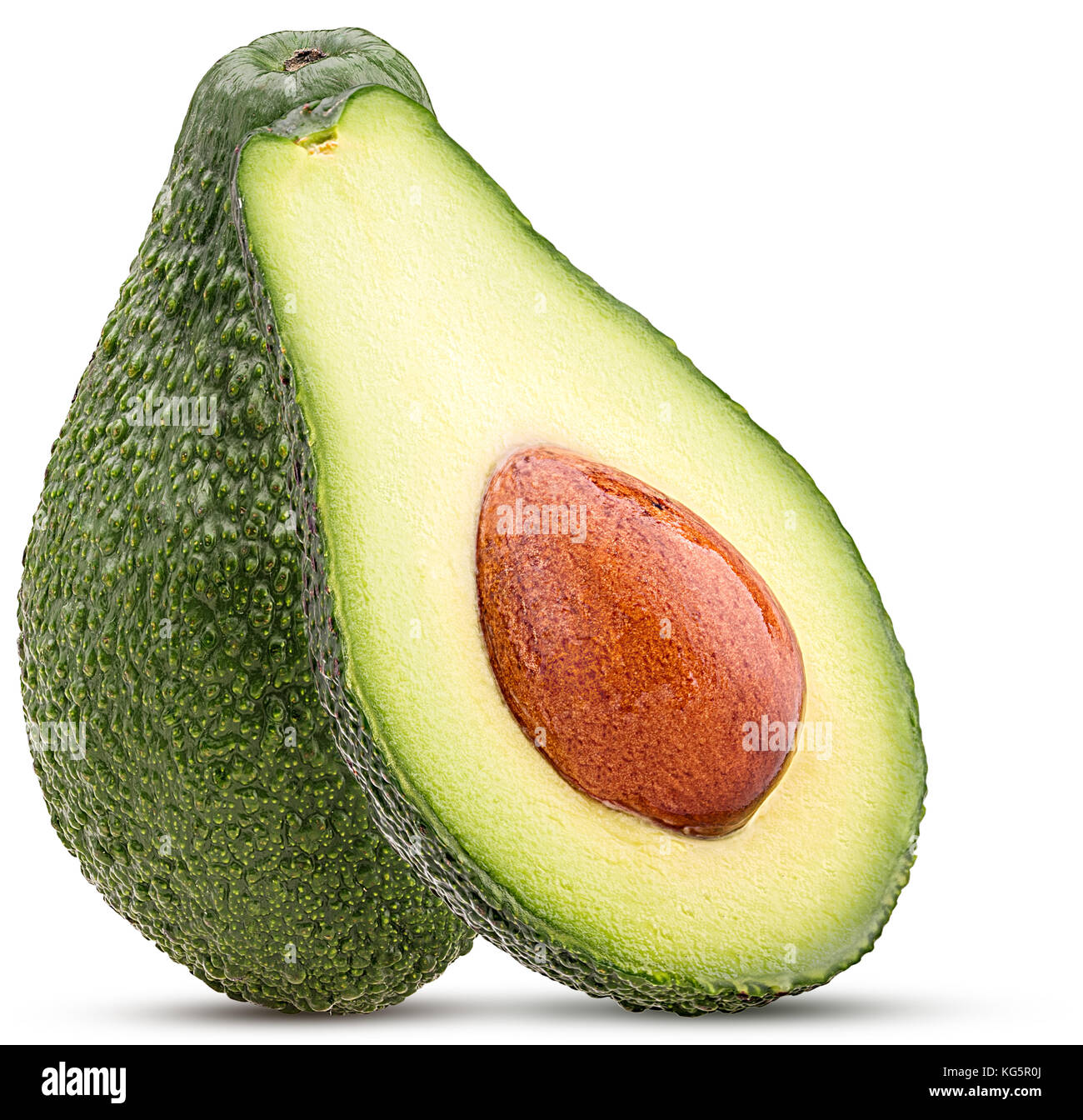 Avocado one cut in half with bone isolated on white background Stock ...