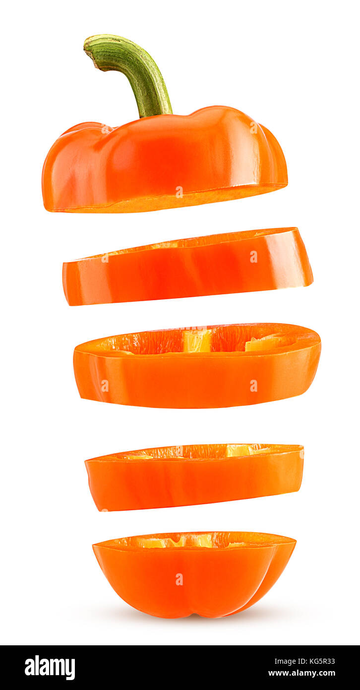 Slices orange bell pepper flying in the air isolated on white ...