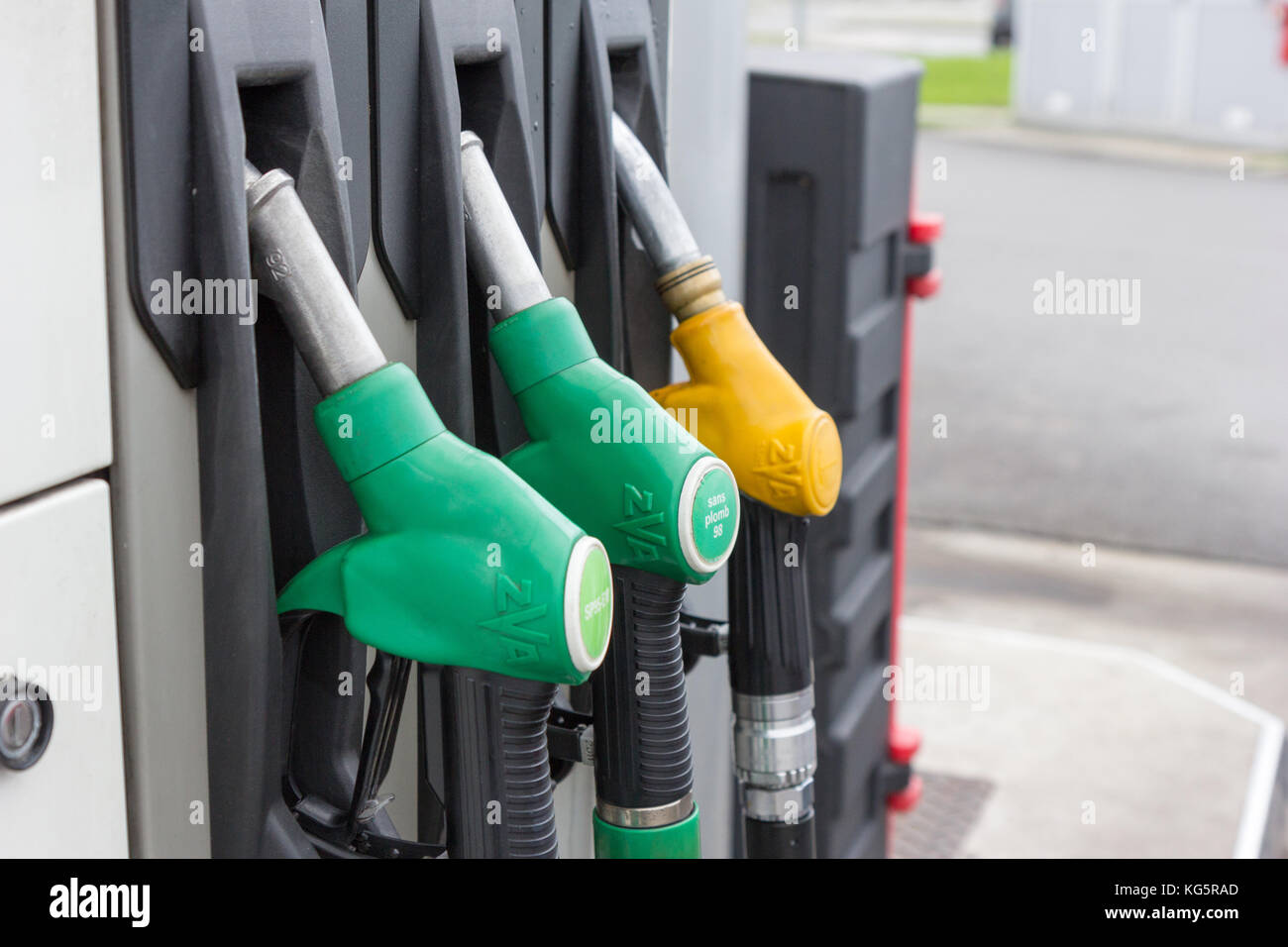 Gas filling nozzles (guns) at a gas station Stock Photo - Alamy