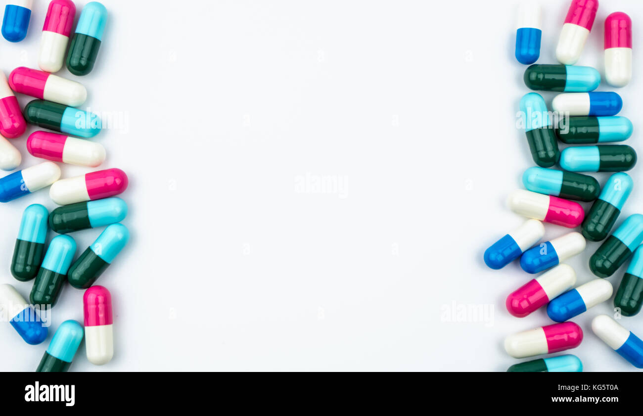 Colorful of antibiotic capsules pills isolated on white background with ...