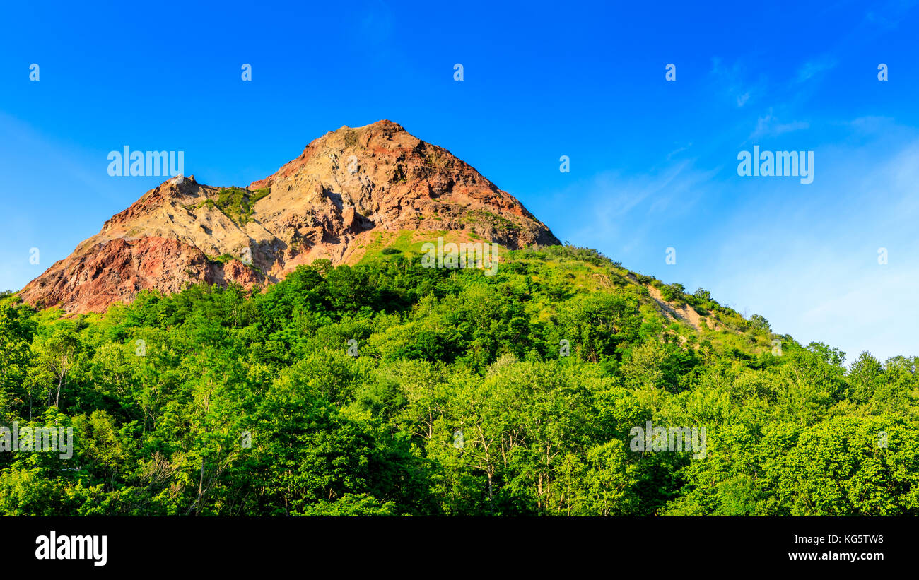 Scene of mountain and blue sky in Hokkaido, Japan Stock Photo - Alamy