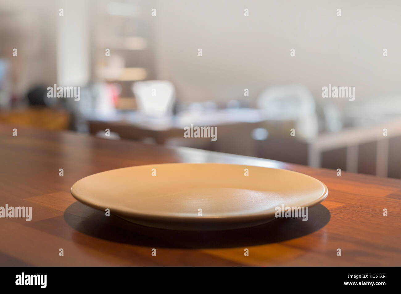 Empty Plate on the kitchen wooden table background Stock Photo - Alamy