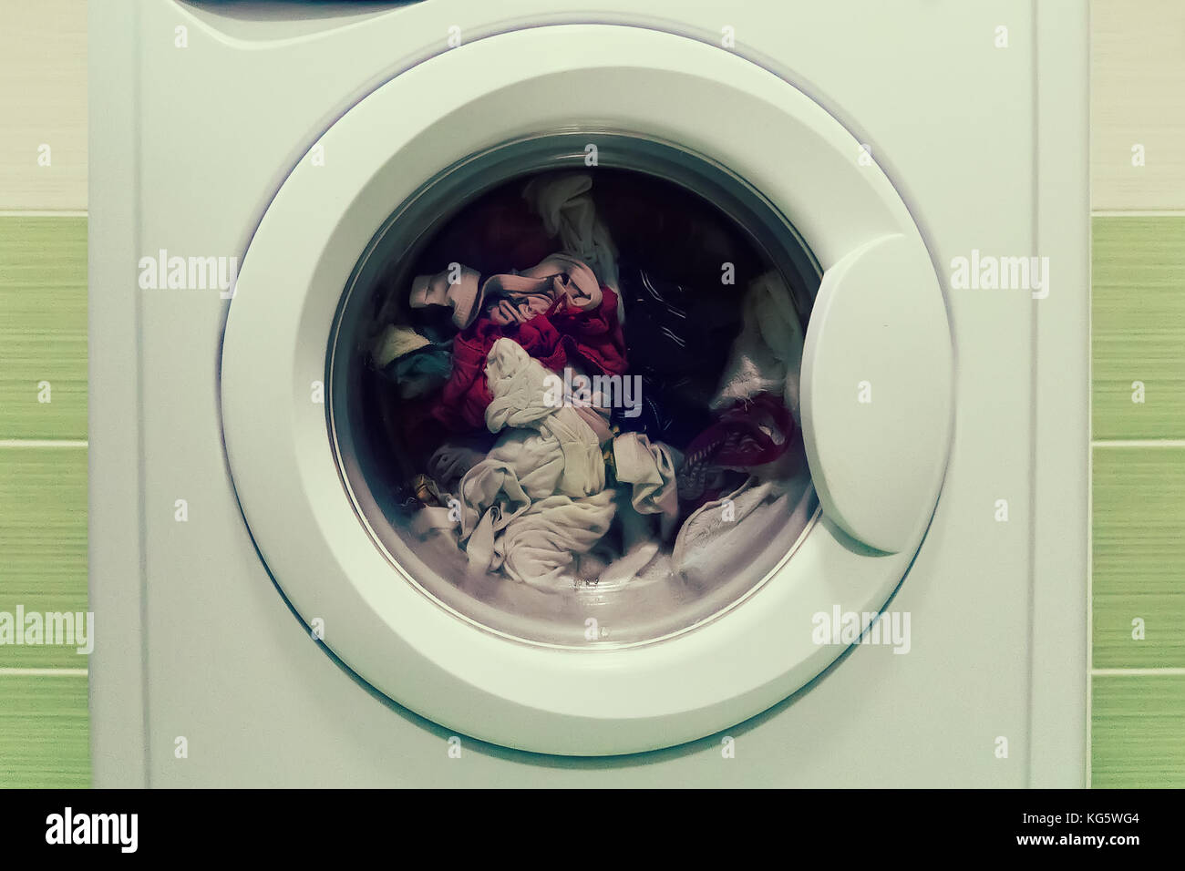 Front view and portion of the porthole of the washing machine during ...