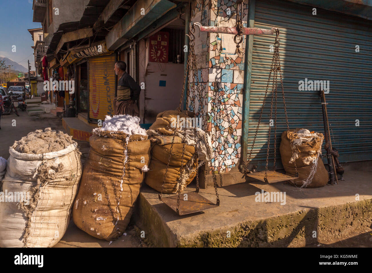 Old traditional scales in a shop window for weighing bales of wool and ...