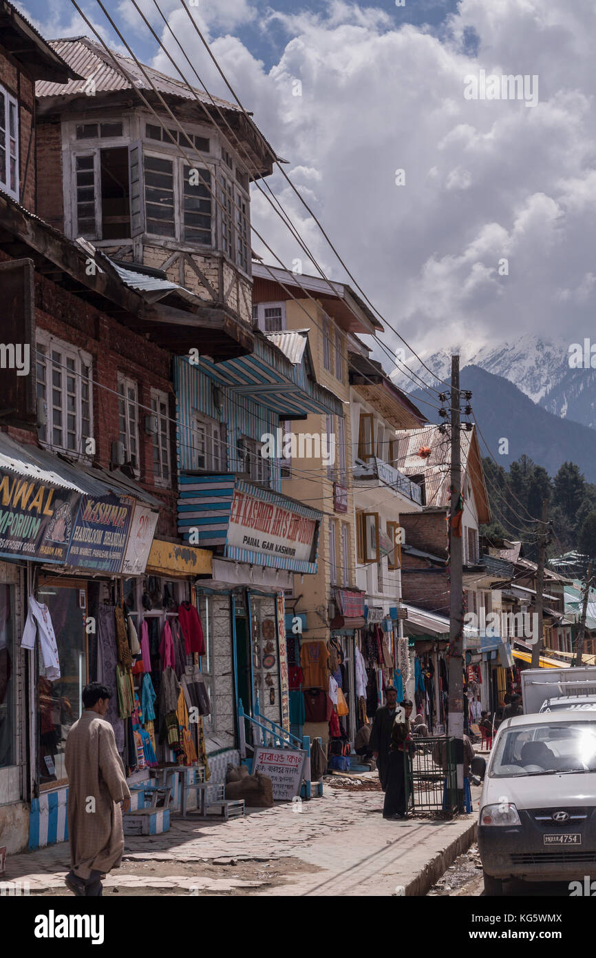 Main street of Pahalgam with Himalayan foothills in the background ...