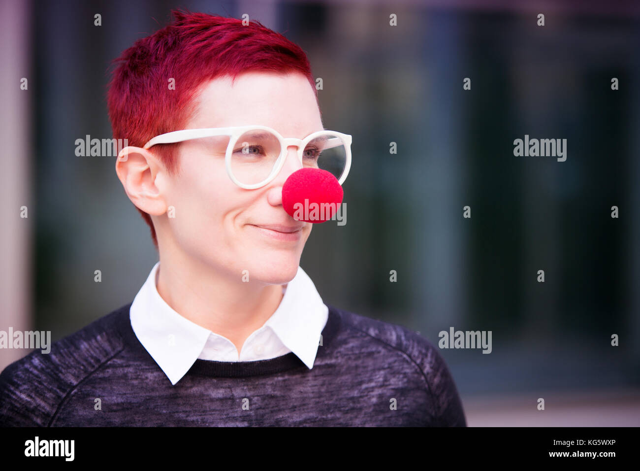 portrait of beautiful red-haired woman with red nose Stock Photo - Alamy
