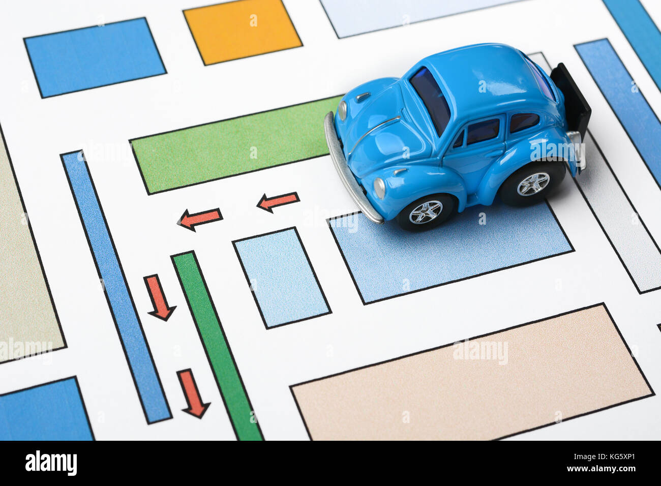 Model of car on road map - closeup Stock Photo - Alamy