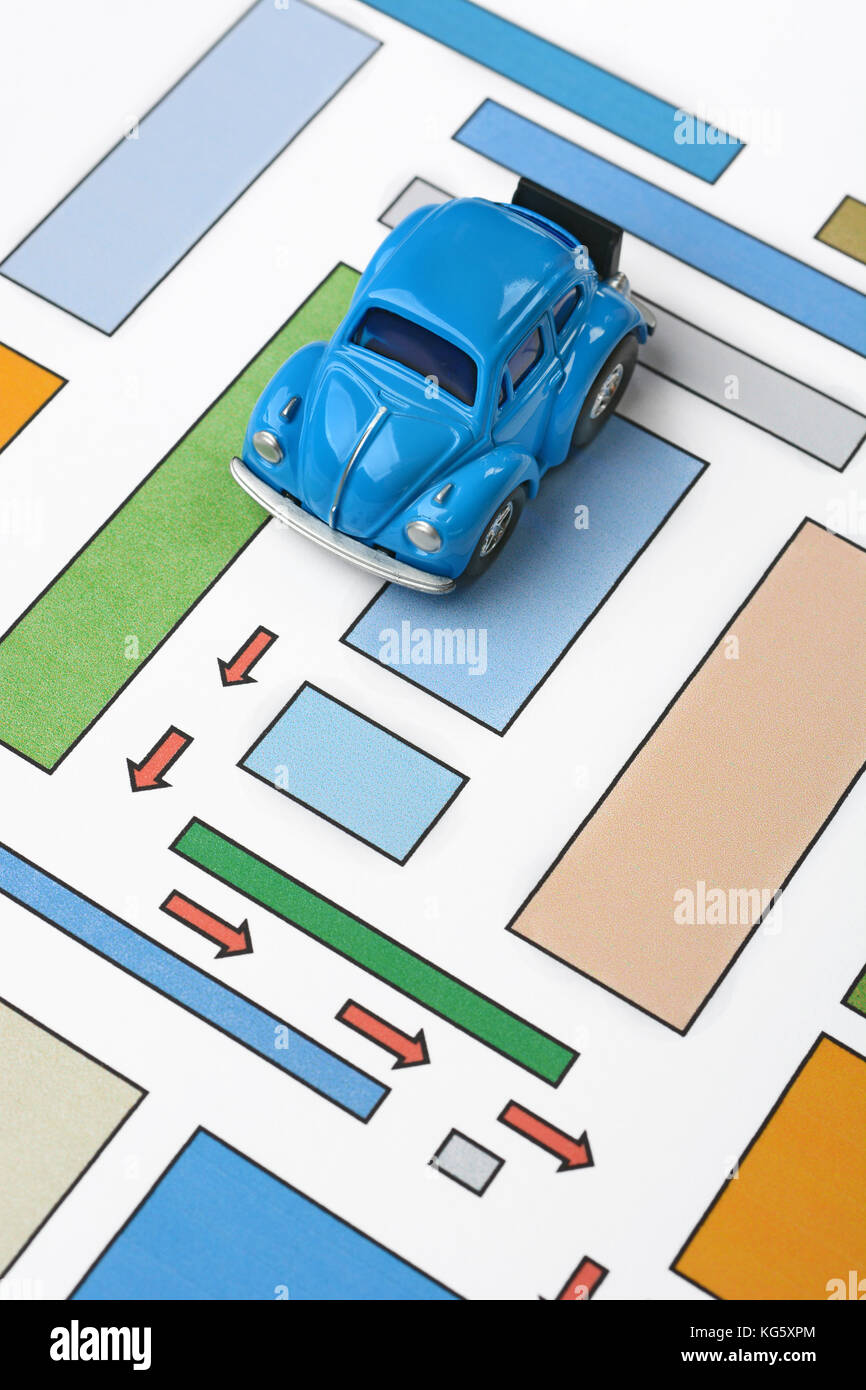 Model of car on road map - closeup Stock Photo - Alamy