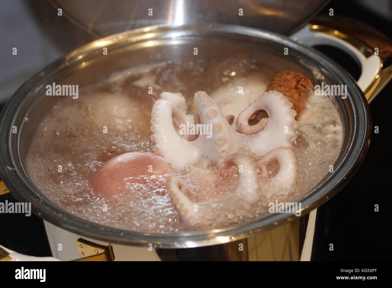 Photo of a small octopus boiling inside a pot with the typicl pot Stock ...