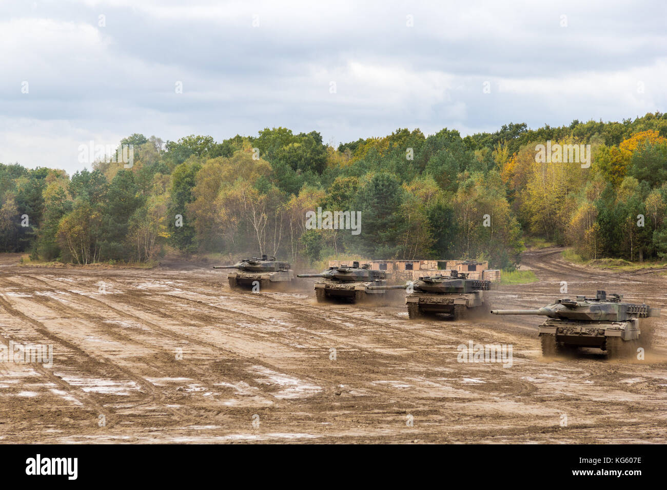 german main battle tanks drives on battlefield Stock Photo - Alamy