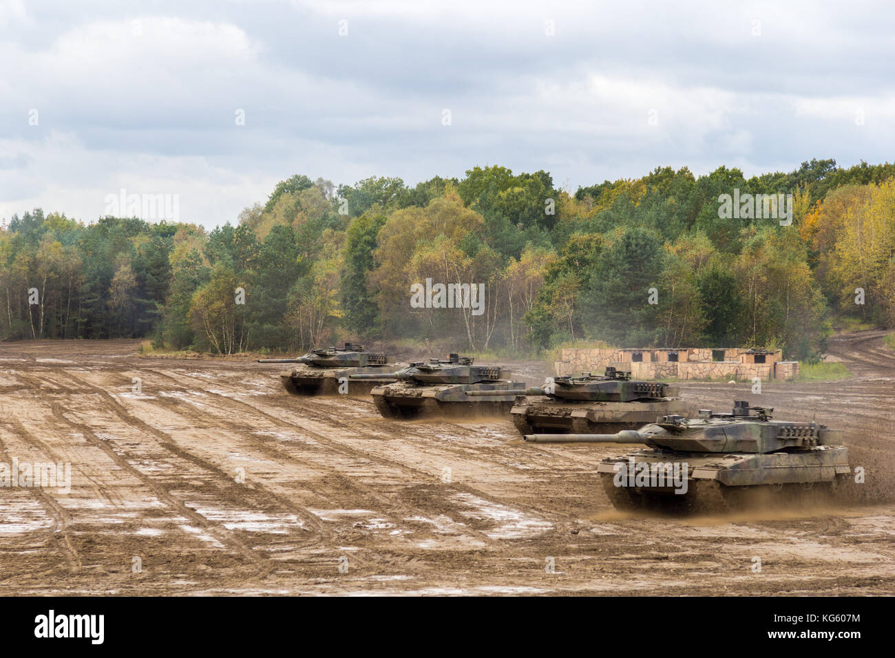 german main battle tanks drives on battlefield Stock Photo - Alamy