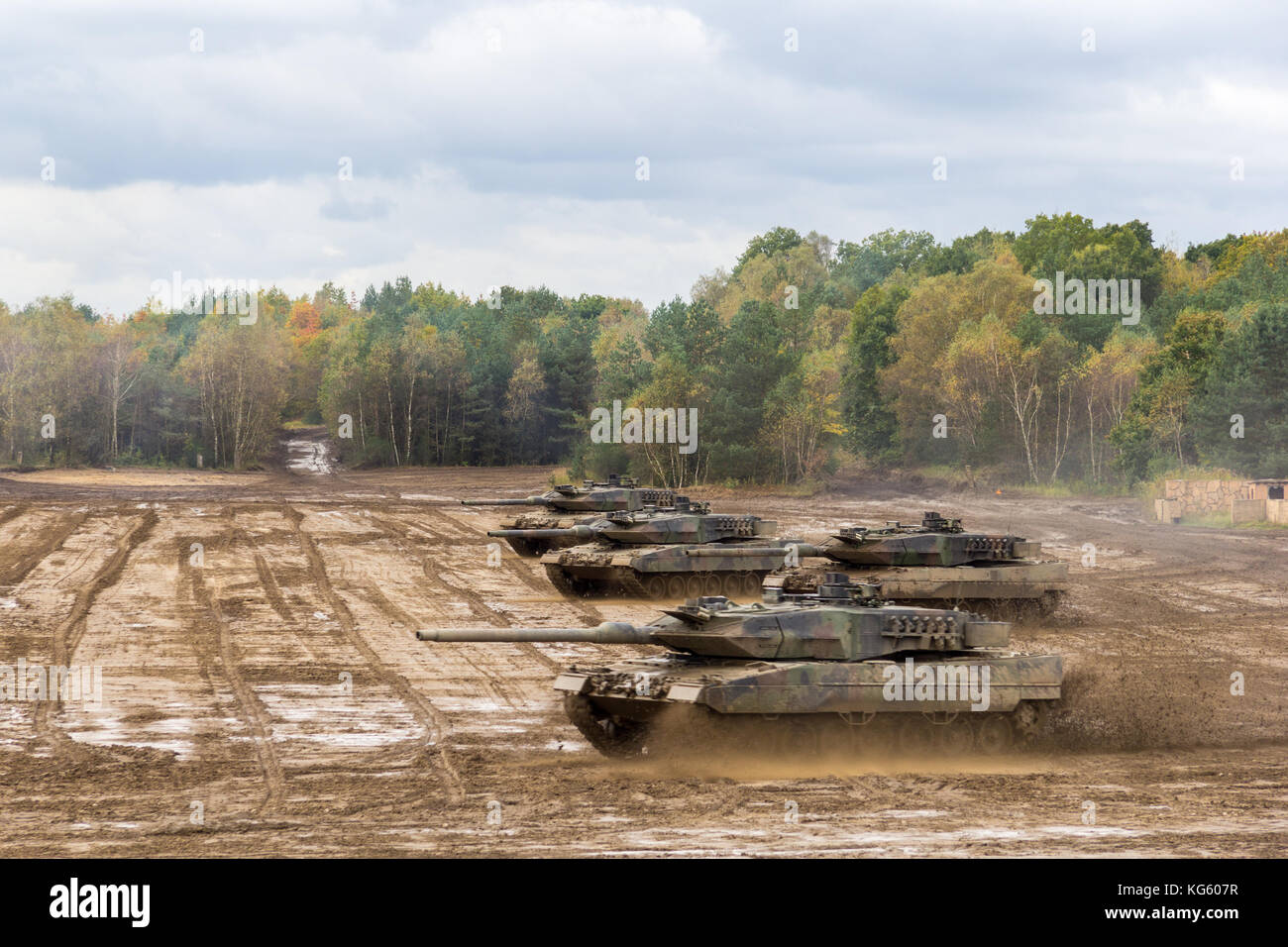 german main battle tanks drives on battlefield Stock Photo - Alamy