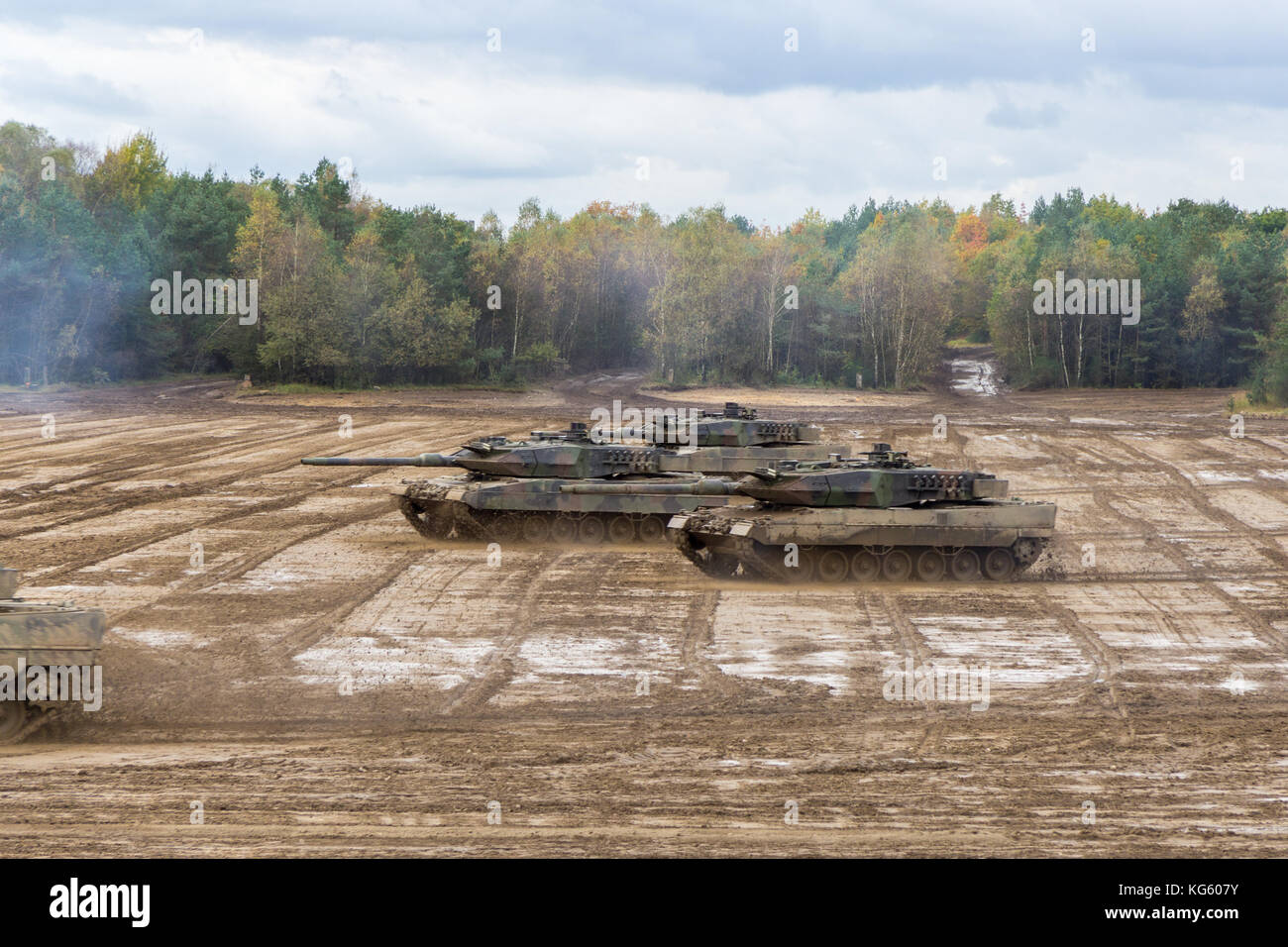 german main battle tanks drives on battlefield Stock Photo - Alamy