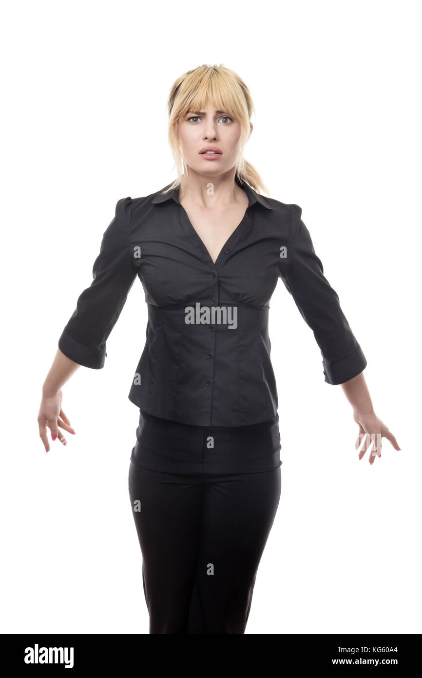 blonde haired business woman standing looking around scared Stock Photo ...