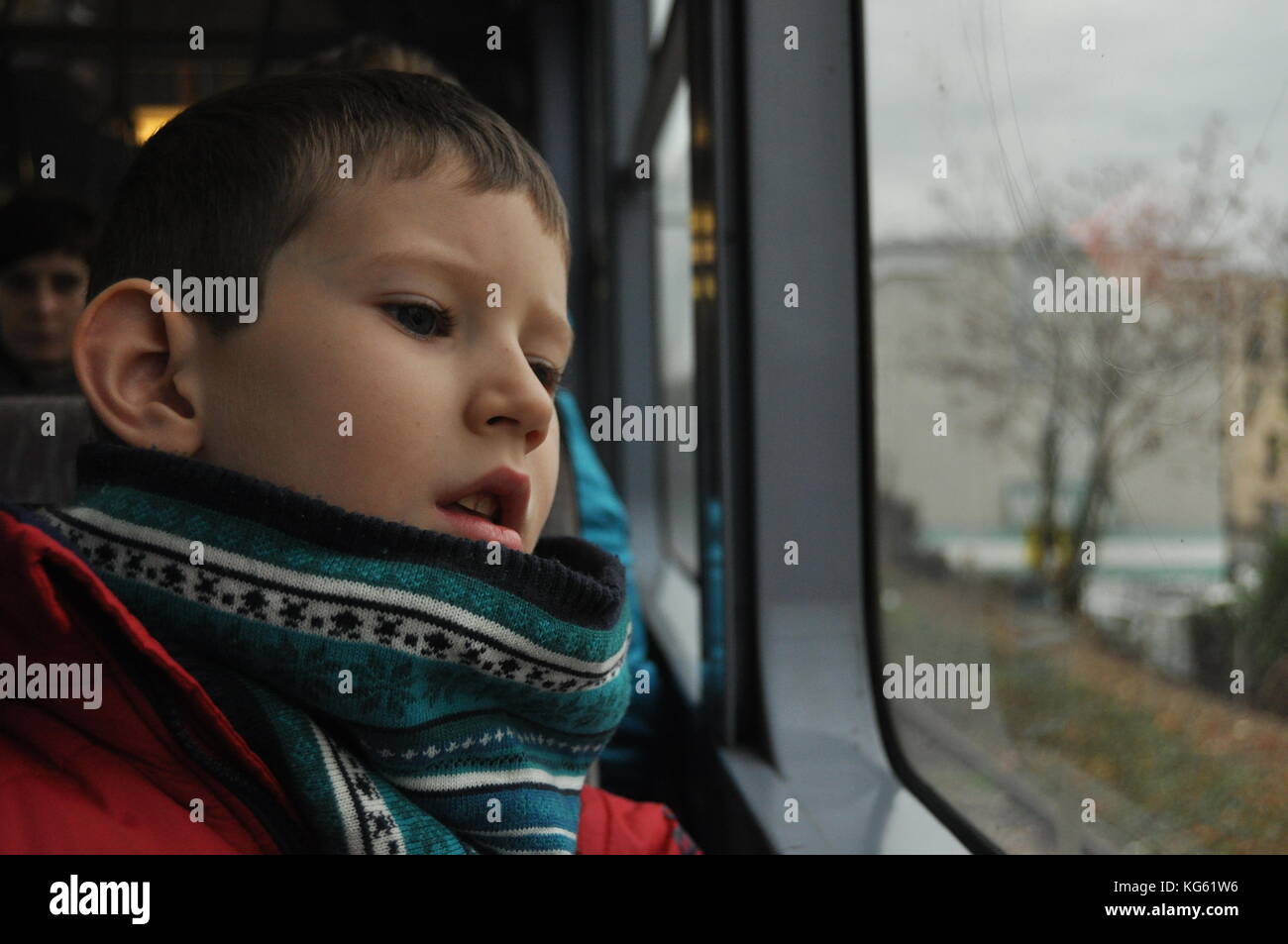 Boy watching the city through the window subway Stock Photo - Alamy