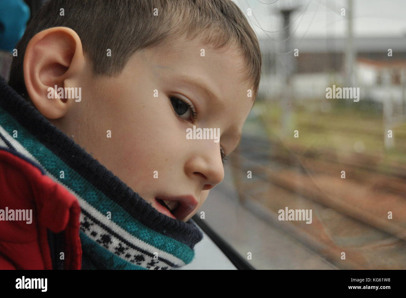 Boy watching the city through the window subway Stock Photo - Alamy