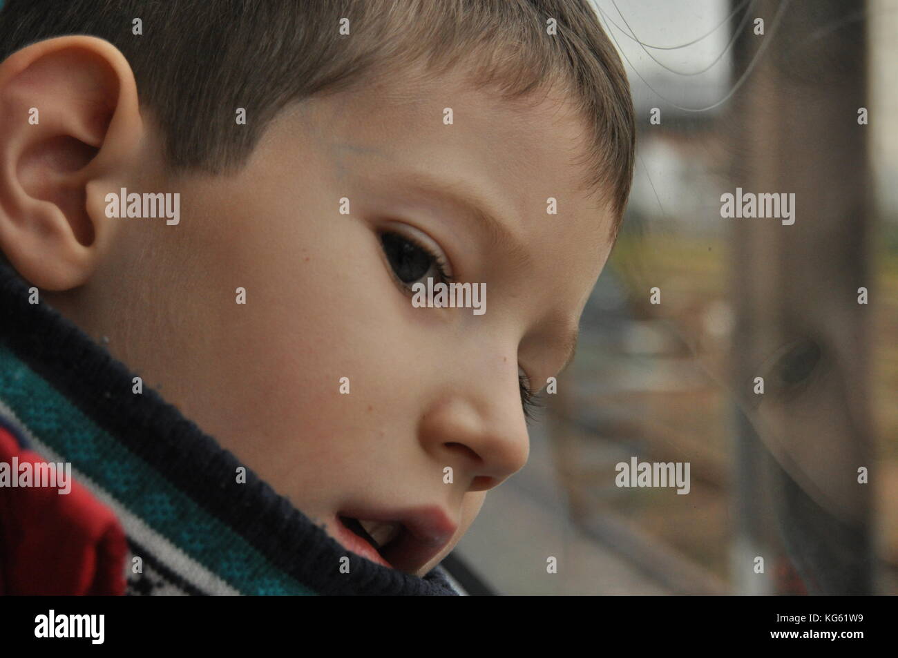 Boy watching the city through the window subway Stock Photo - Alamy