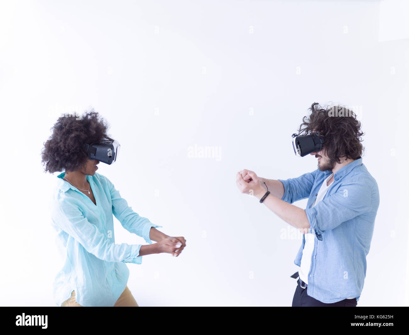 Happy multiethnic couple getting experience using VR headset glasses of ...