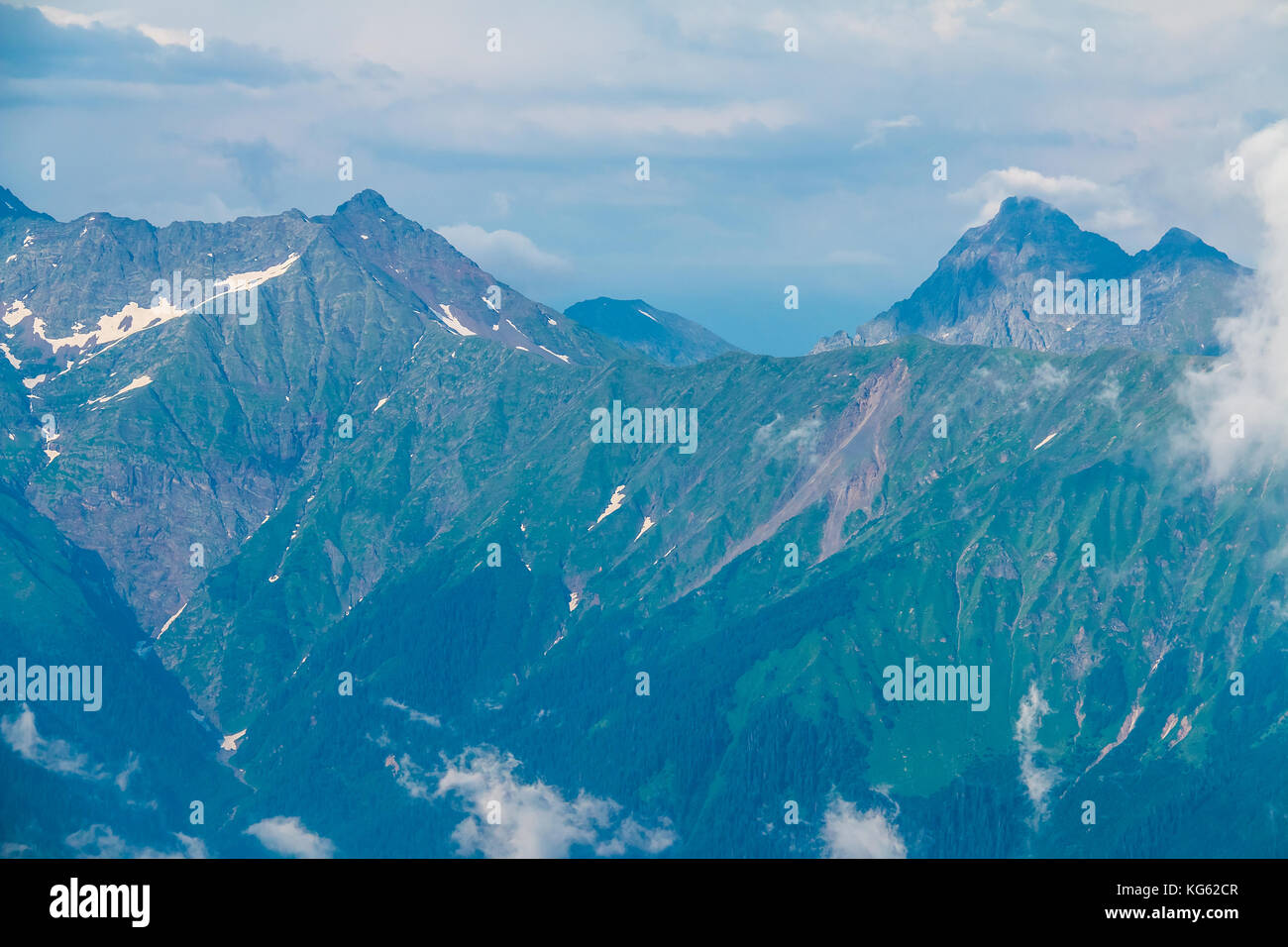 View of distant ridges in blue haze in cloudy day Stock Photo - Alamy